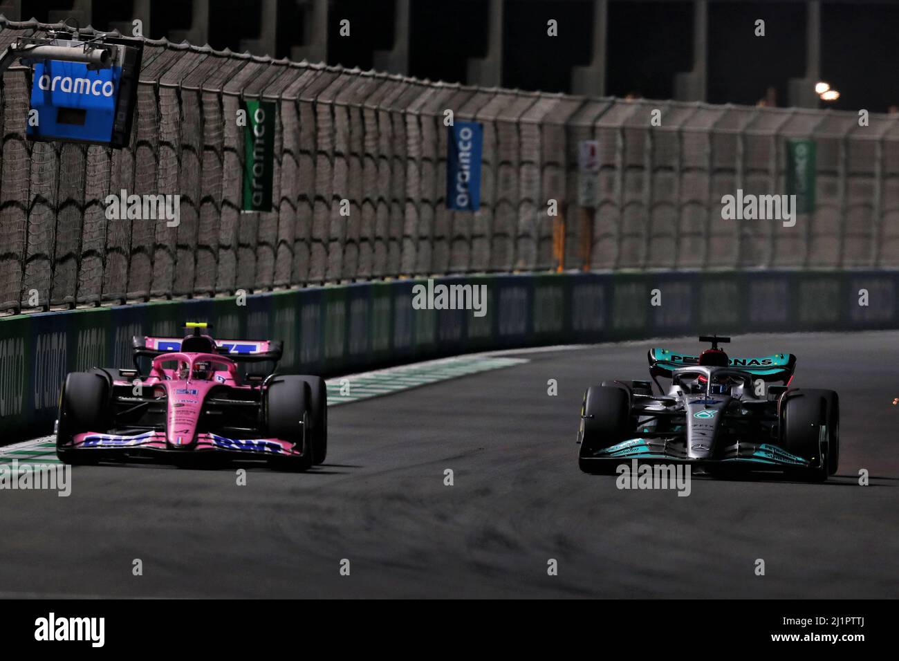 Esteban Ocon (FRA) Alpine F1 Team A522 and George Russell (GBR) Mercedes AMG F1 W13 battle for ...