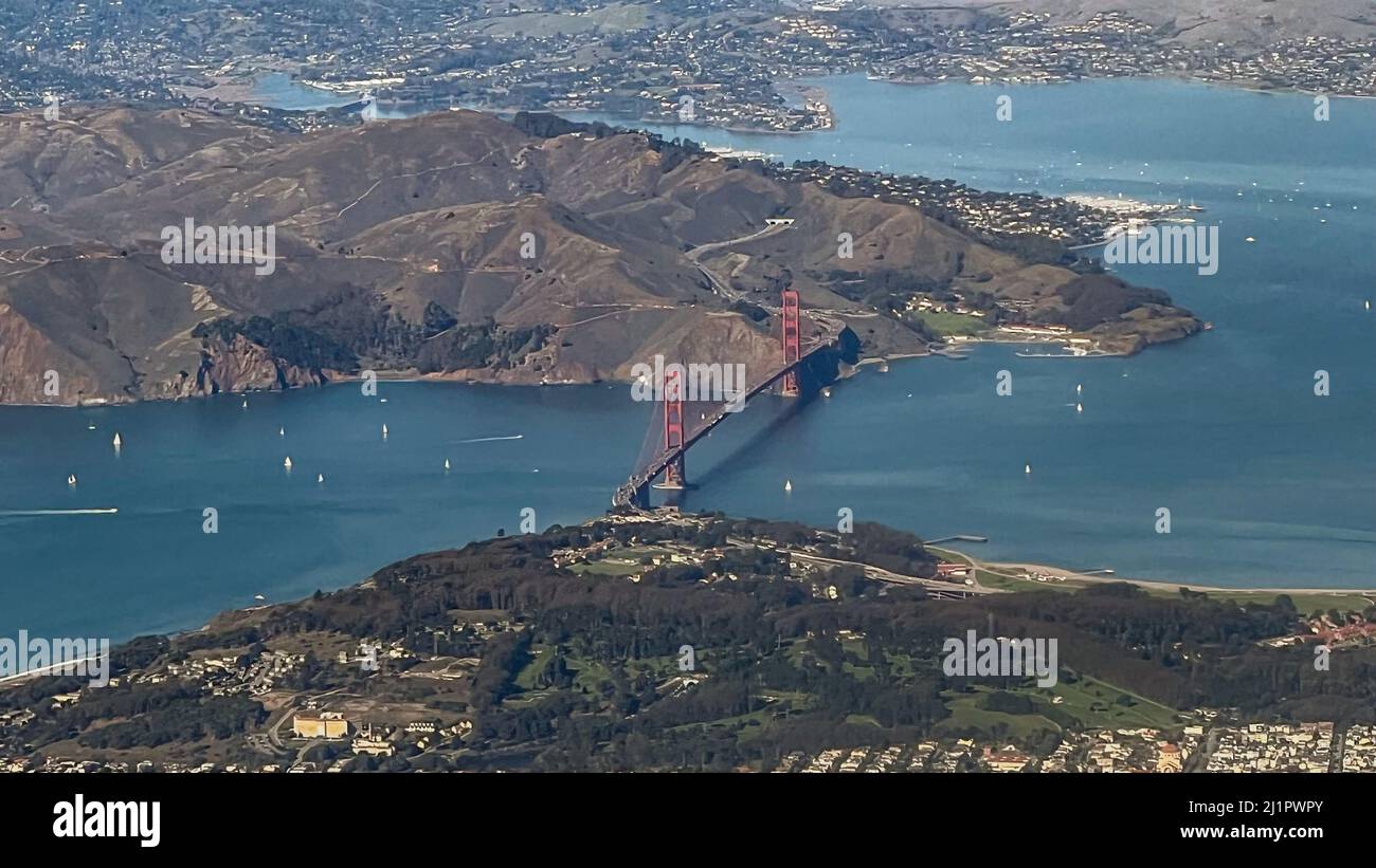 An aerial view of the Golden Gate Bridge and the city from a plane of ...