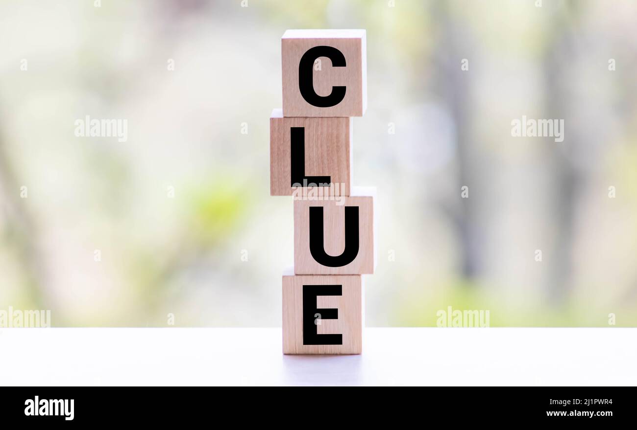 word clue on white toy cubes, word concept Stock Photo - Alamy