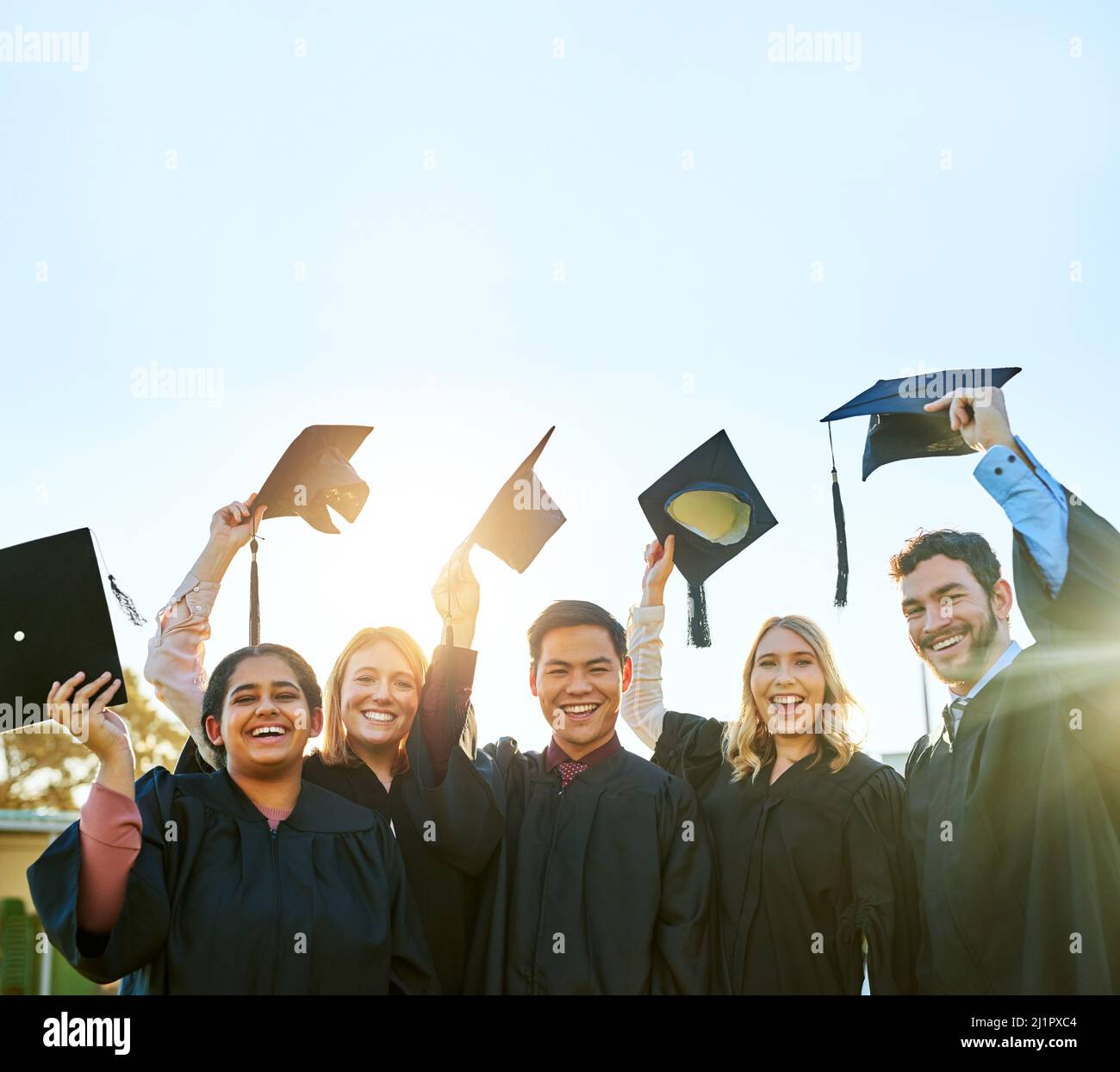 It feels amazing to finally graduate. Portrait of a group of students ...