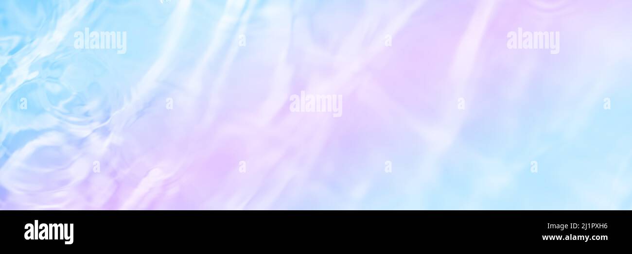 Serum or water texture close up. Light blue and pink gradient liquid ...