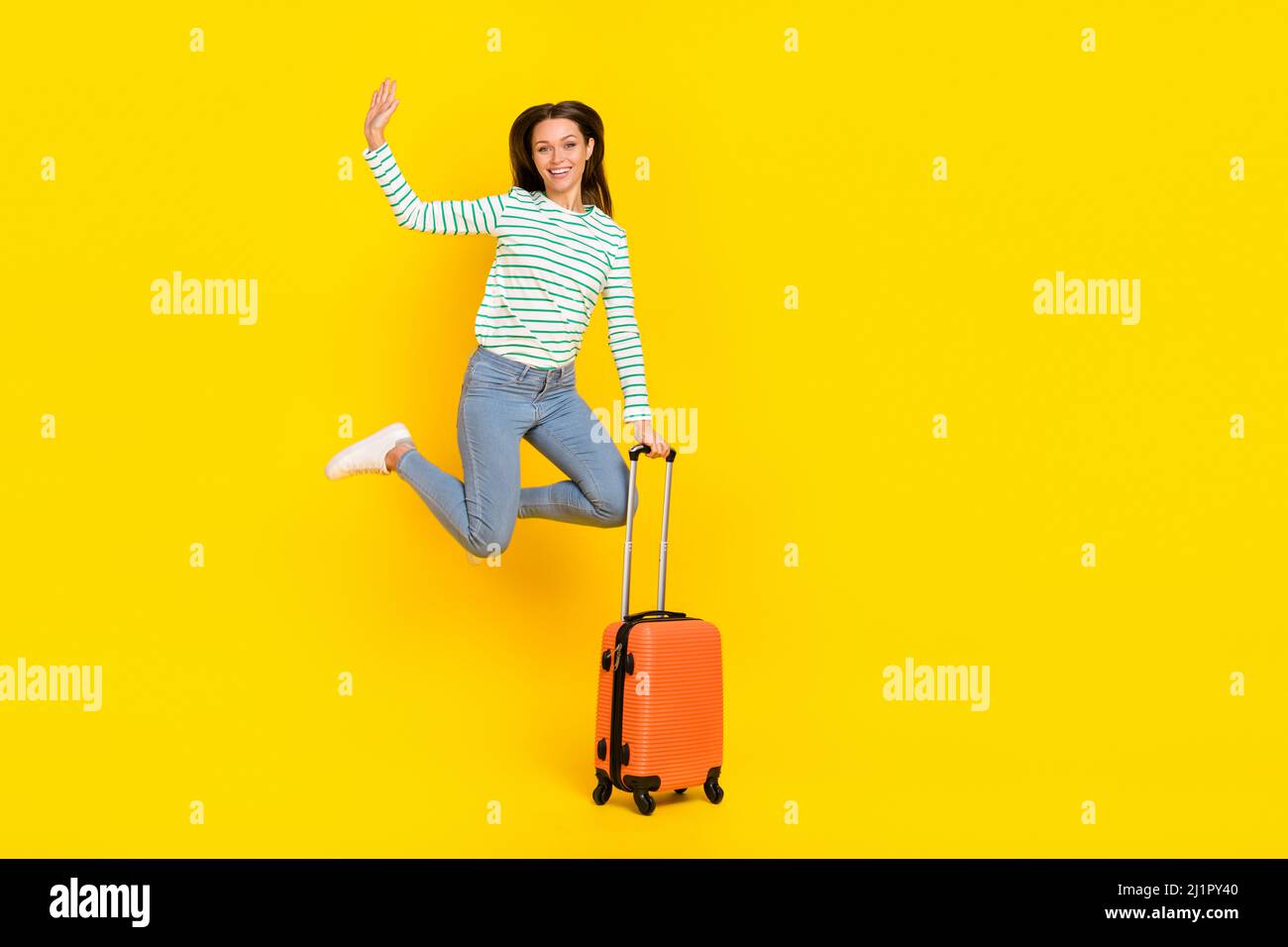 Full body photo of young lovely girl jump wave bye tourist airport ...