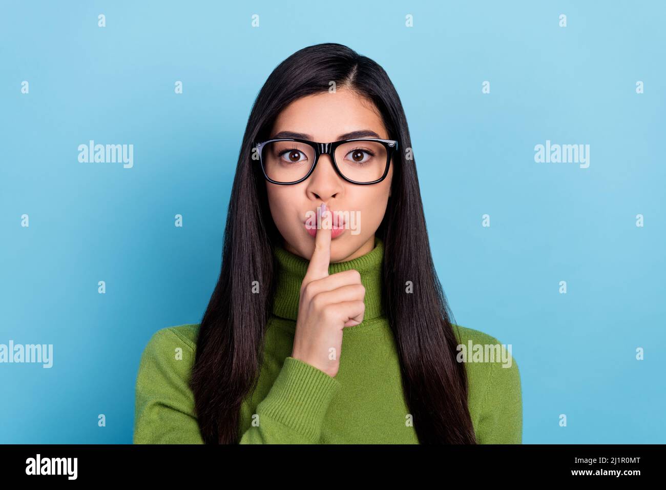 Portrait of attractive smart clever long-haired girl nerd showing shh ...