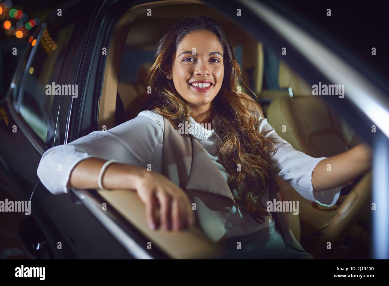 Finally heading home after work. Portrait of an attractive young ...