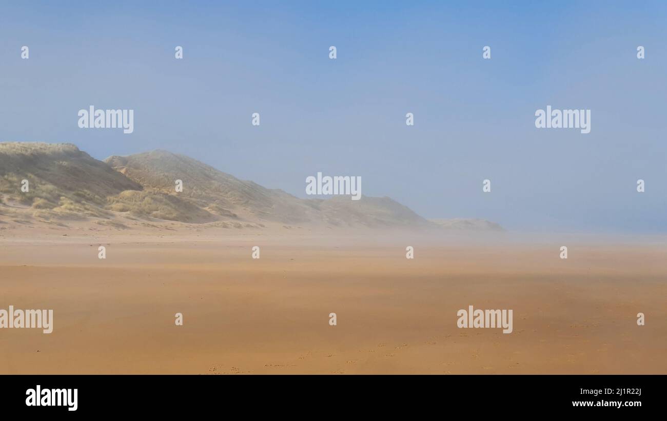 Mist over sea and sand Stock Photo - Alamy
