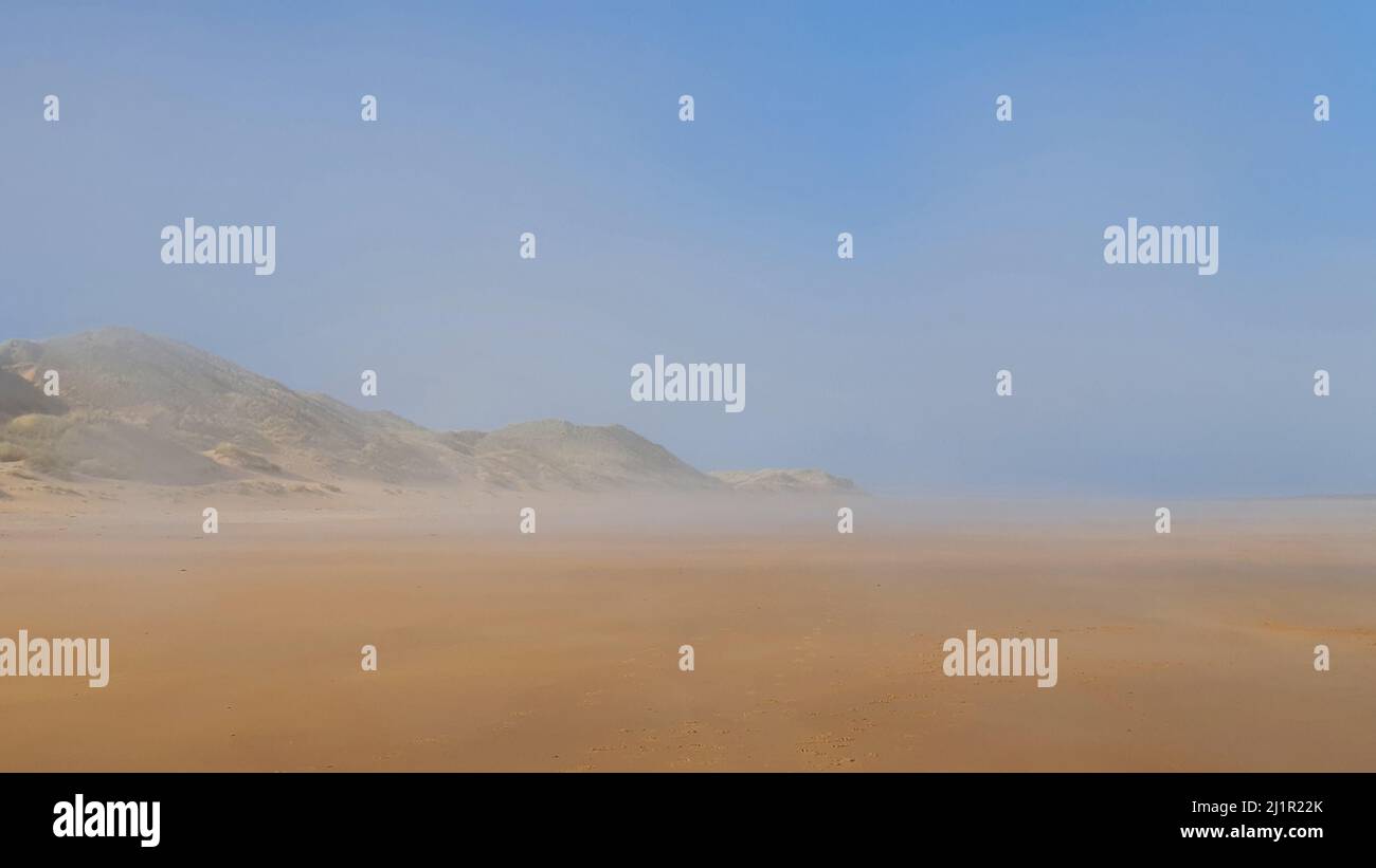 Mist over sea and sand Stock Photo - Alamy