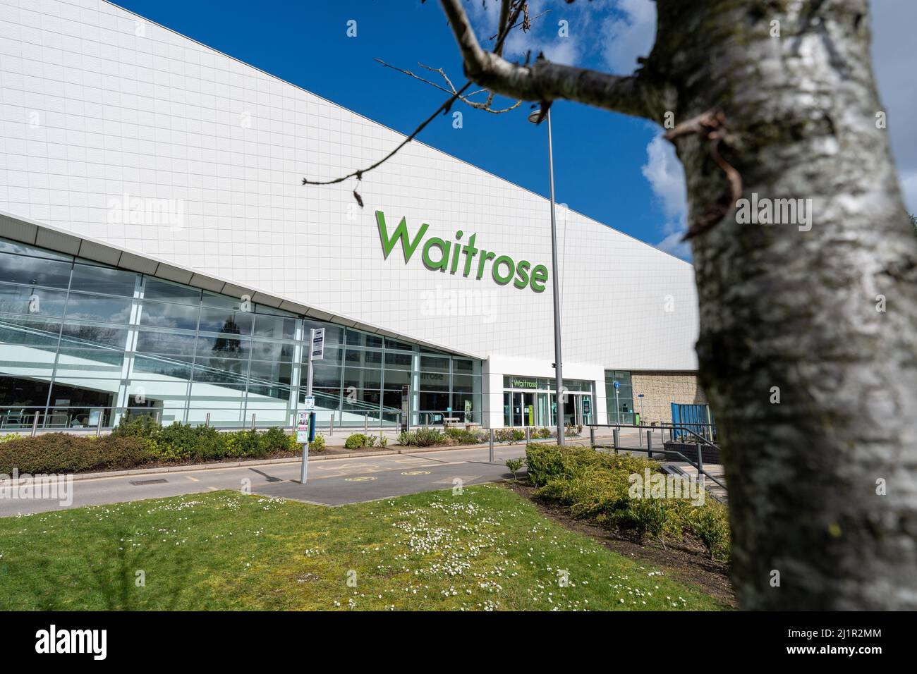 A distant shot of the Waitrose Supermarket building on a cloudy day in ...