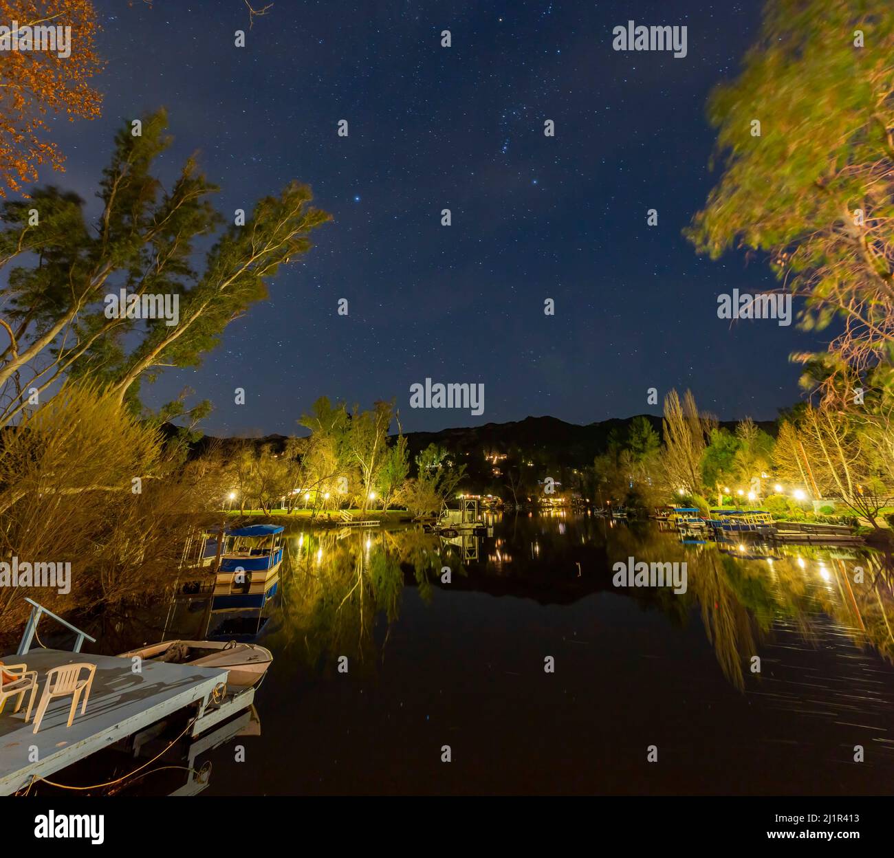 Night view of the Malibu Lake with stars at Los Angeles County ...