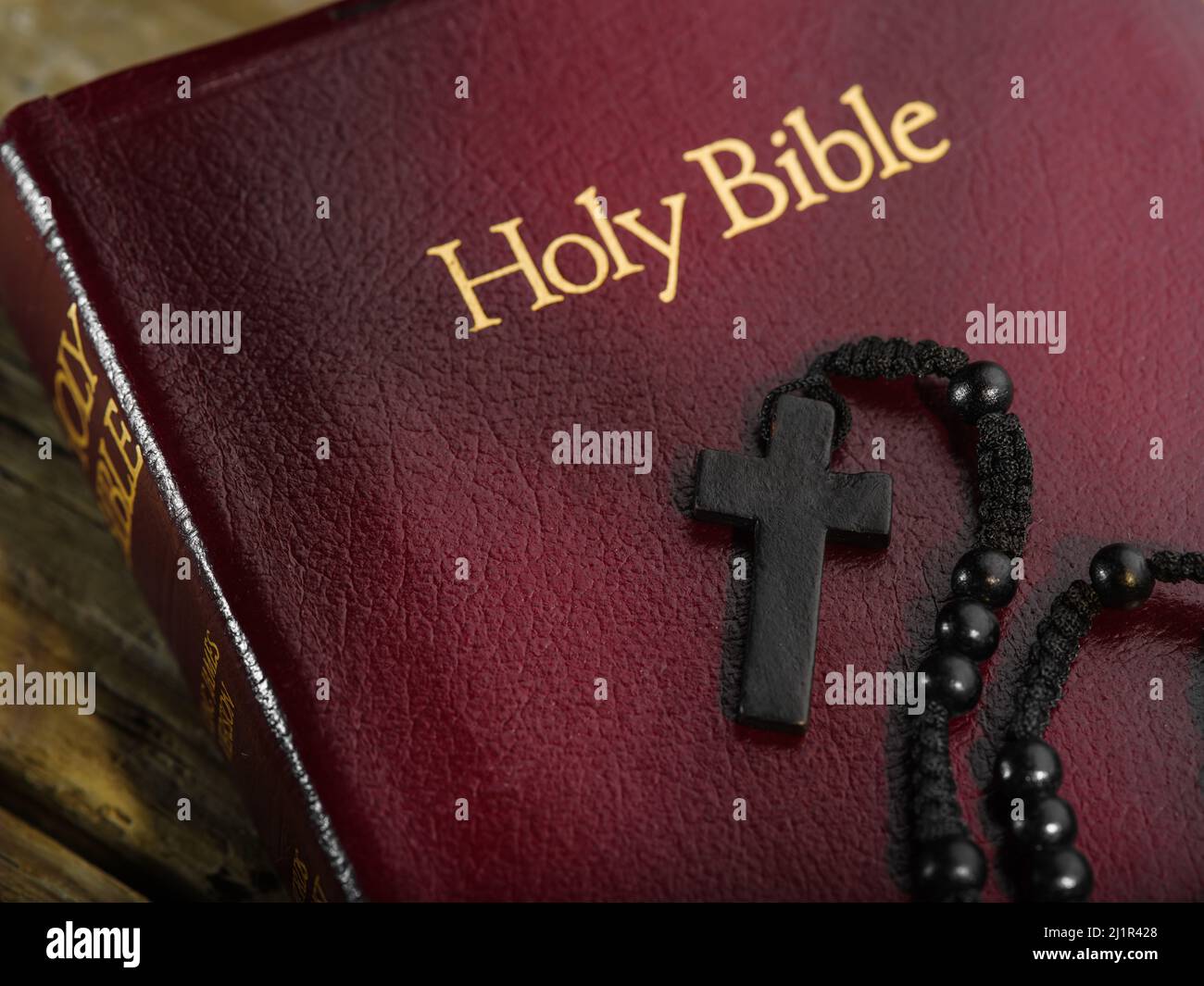 Macro shot. Holy bible and catholic cross on the rosary. Symbols of ...