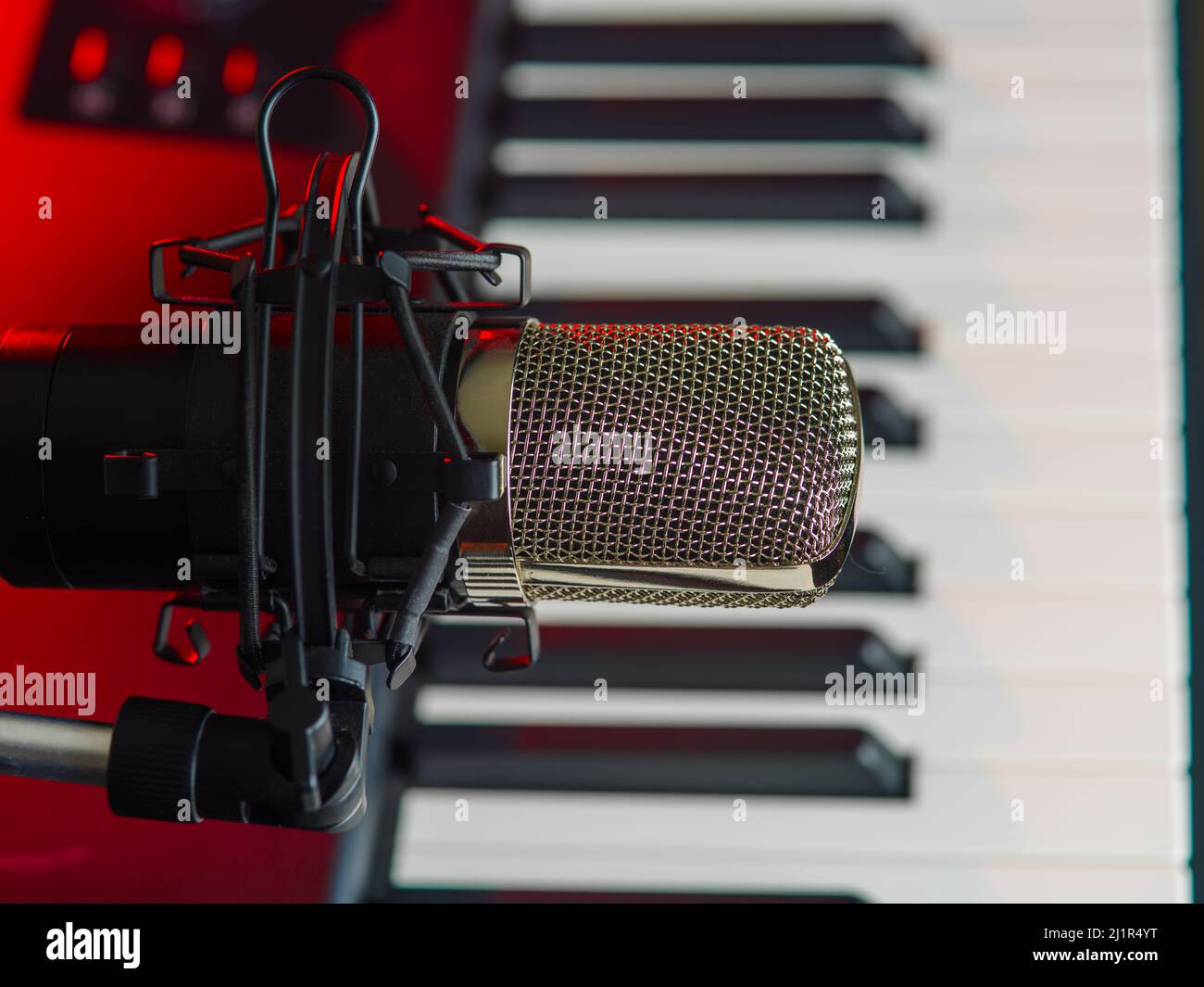 Close-up. Modern synthesizer, MIDI keyboard and microphone. Modern ...