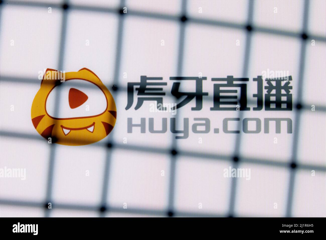 The logo of the Huya live streaming service behind bars. The concept of ...