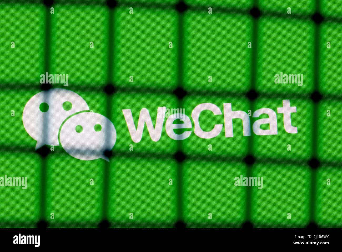 The logo of the WeChat messenger behind bars. The concept of WeChat ...
