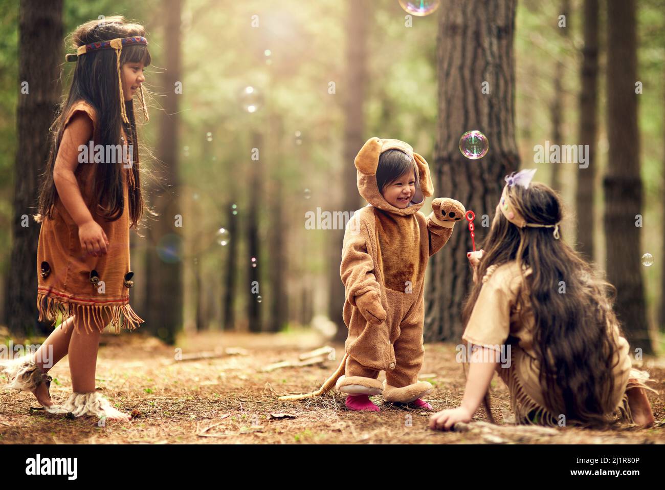 The land of make believe. Full length shot of three little girls ...