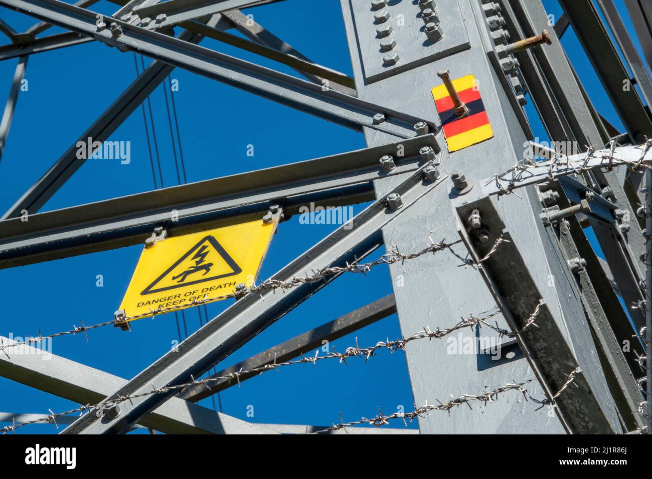 Lower section of a transmission tower with 'Danger of Death' warning ...