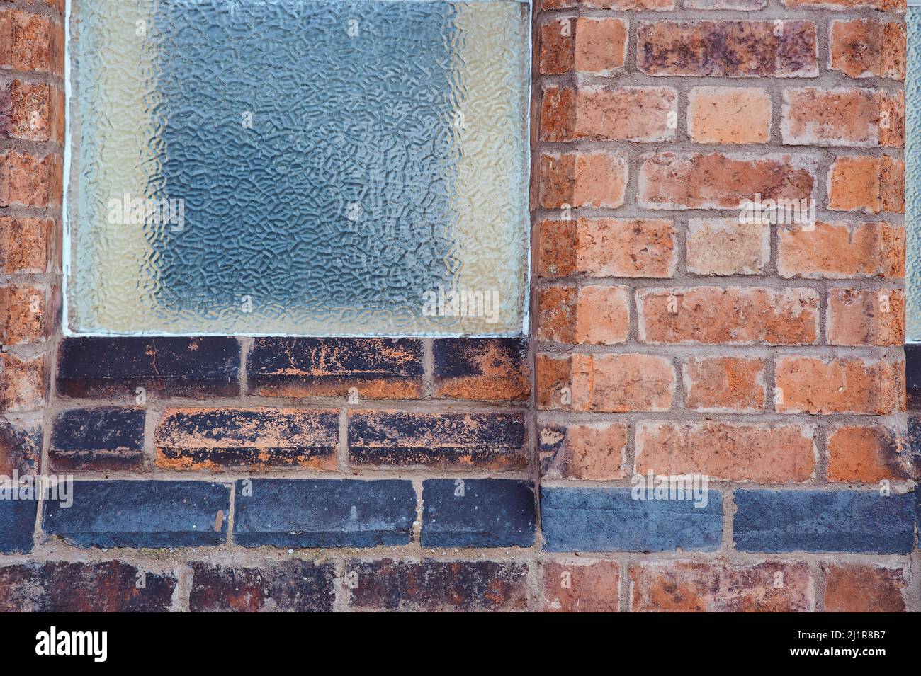pattern background image of frosted window on old redbrick wall with ...