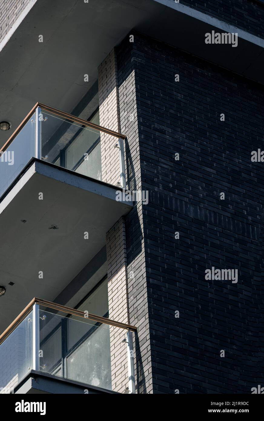 new residential brick building with balconies. modern practical ...