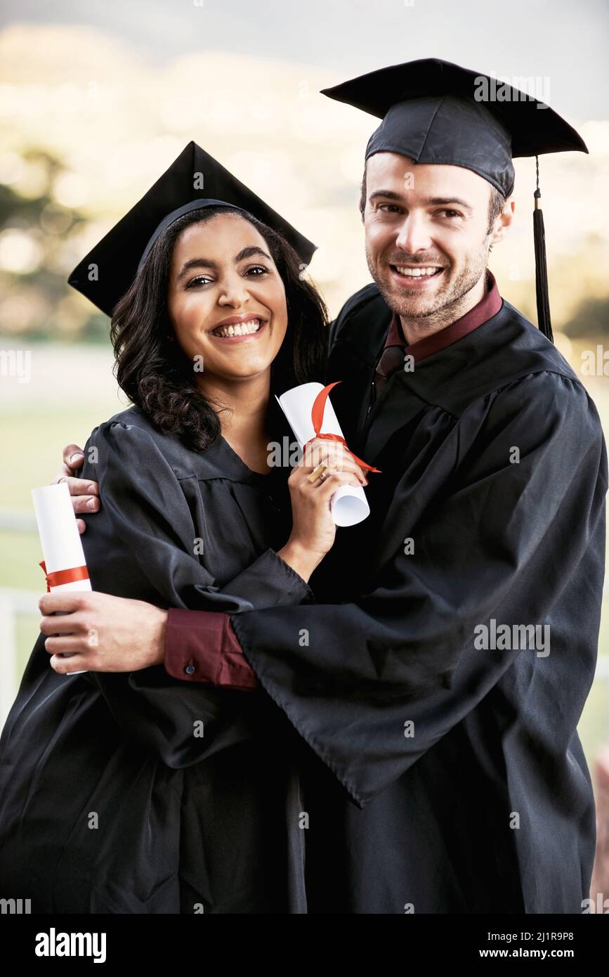 Our efforts have paid off well. Portrait of two students on graduation ...
