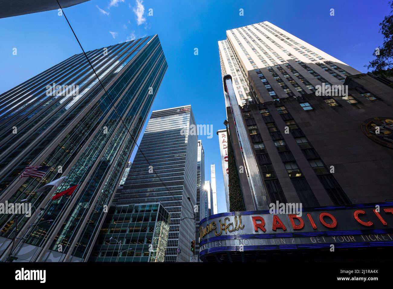 Rows of high-rise buildings stand along 6th Avenue in Midtown Manhattan ...