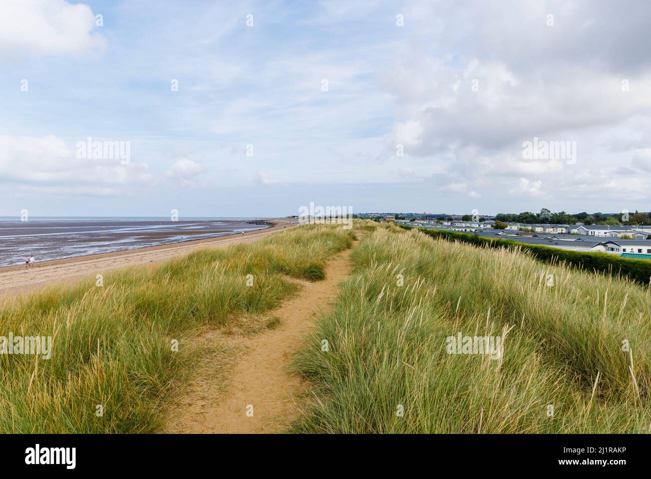 Sand dunes and coast path at Heacham North Beach, a coastal village in ...