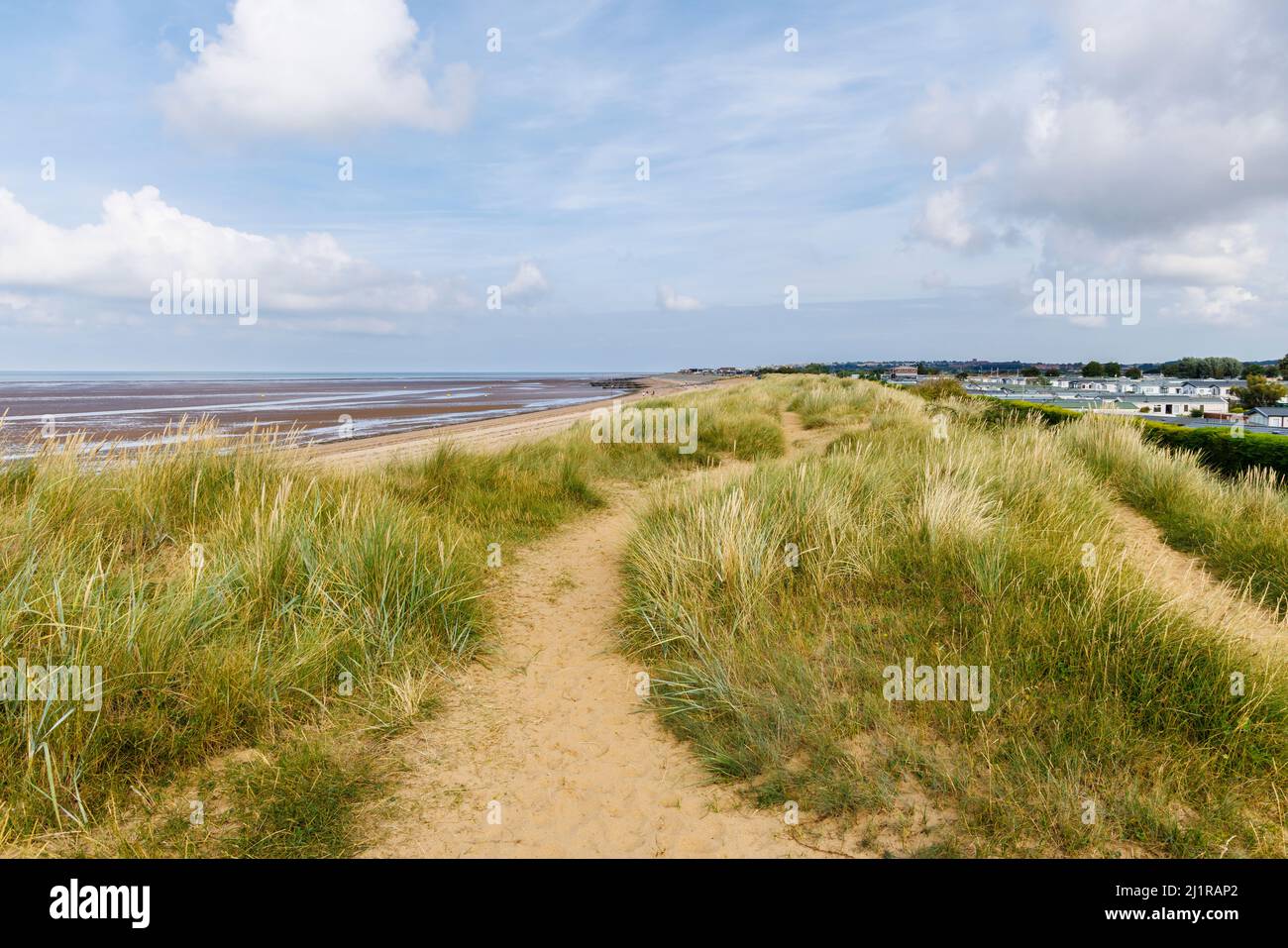 Sand dunes and coast path at Heacham North Beach, a coastal village in ...