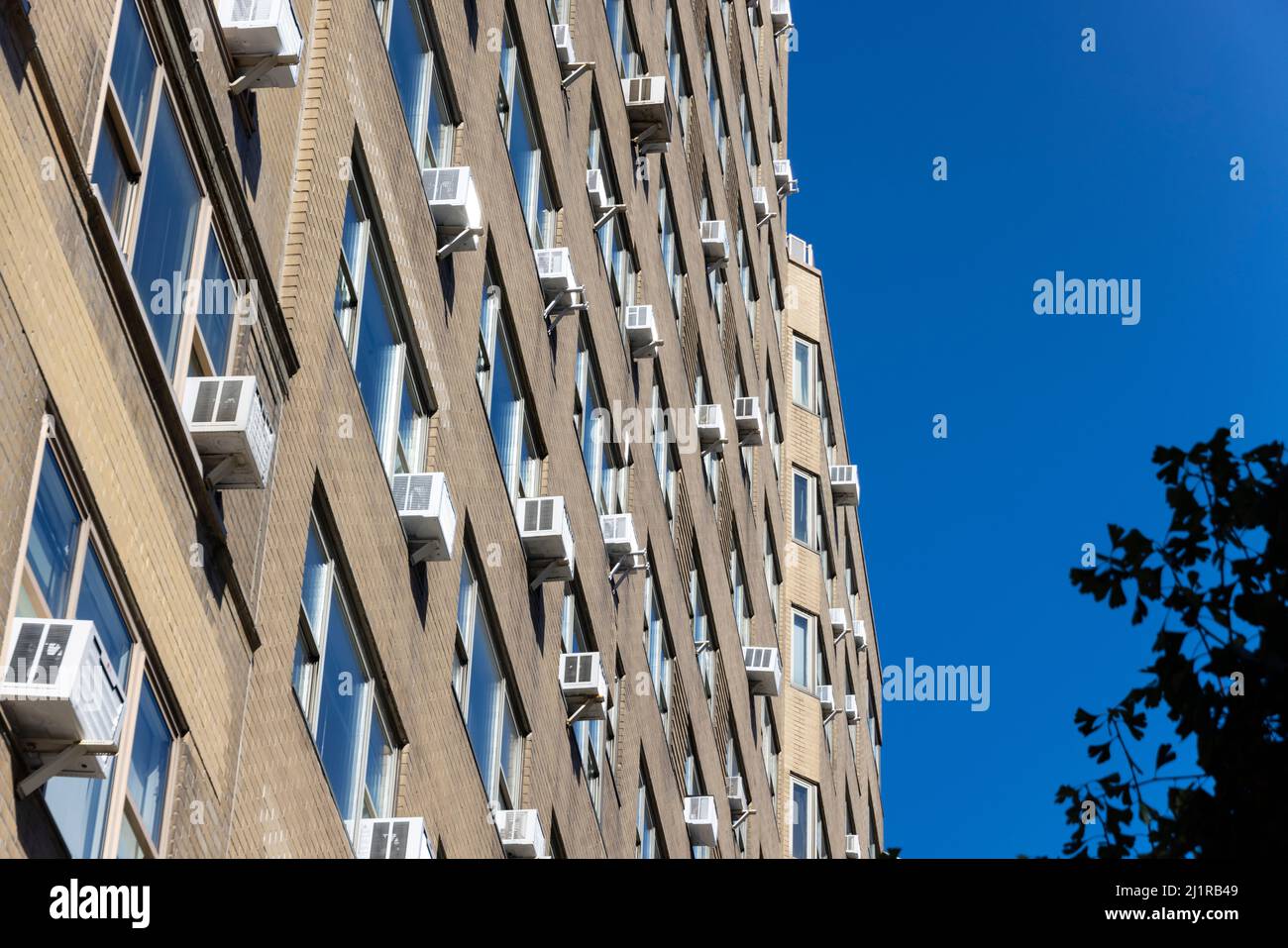 Many air conditioners installed at windows of residential buildings NYC ...
