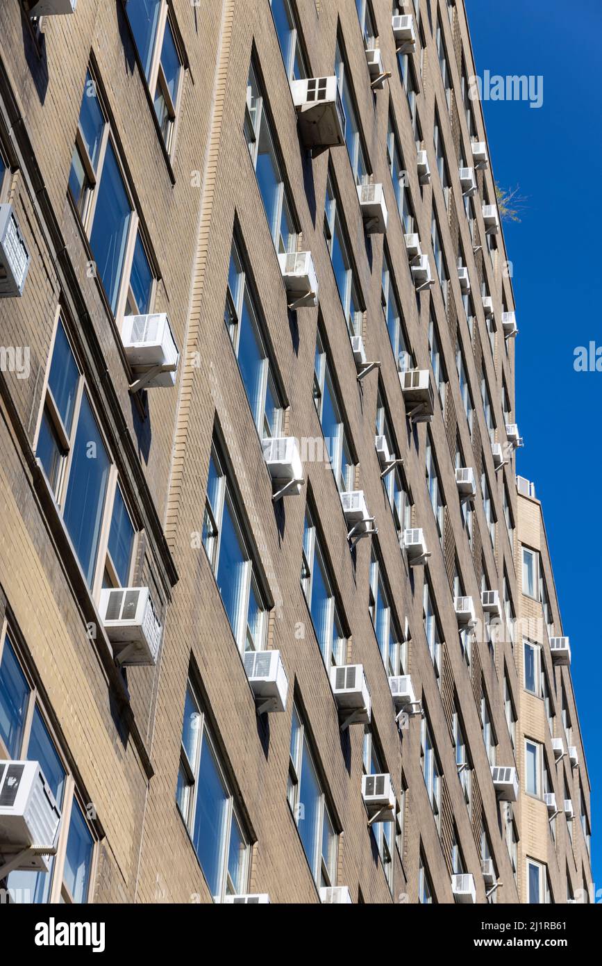 Many air conditioners installed at windows of residential buildings NYC ...