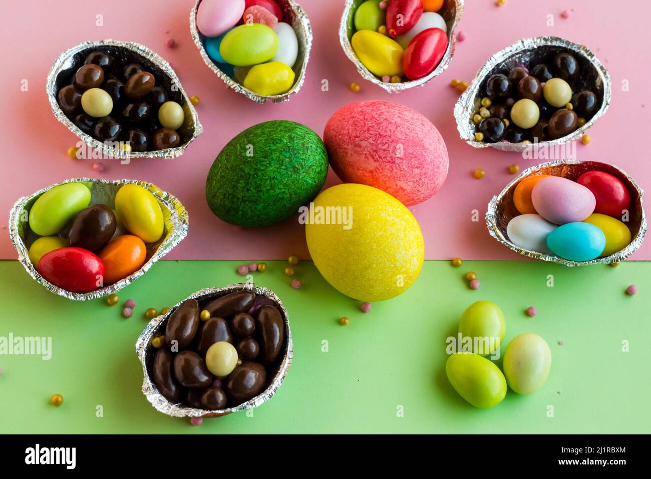 Decorative colored Easter Eggs and colorful candies,chocolates designed ...