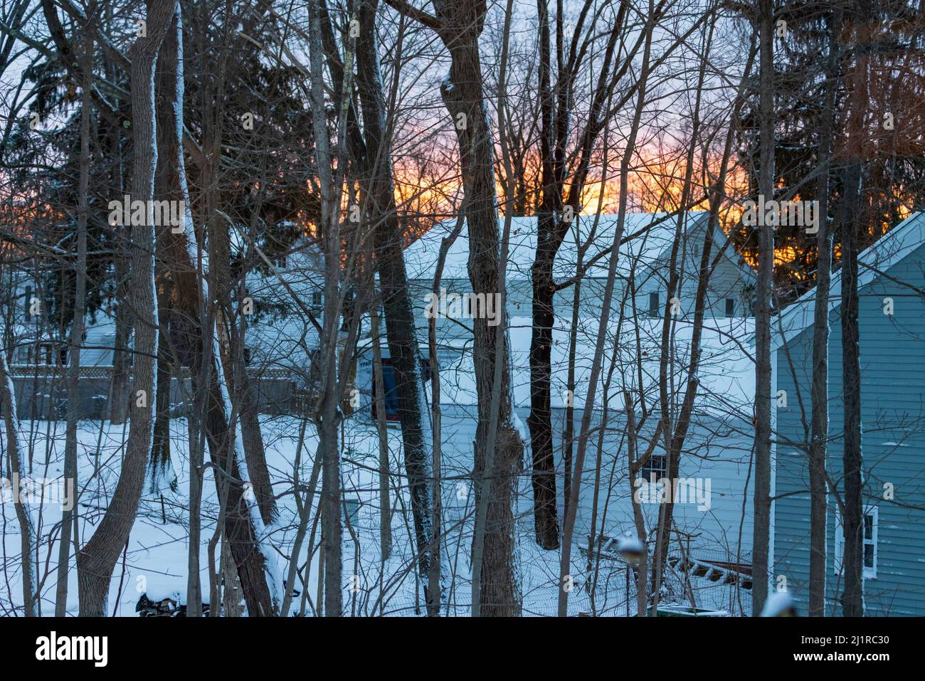 Snow covered house in snow at sunset Stock Photo - Alamy