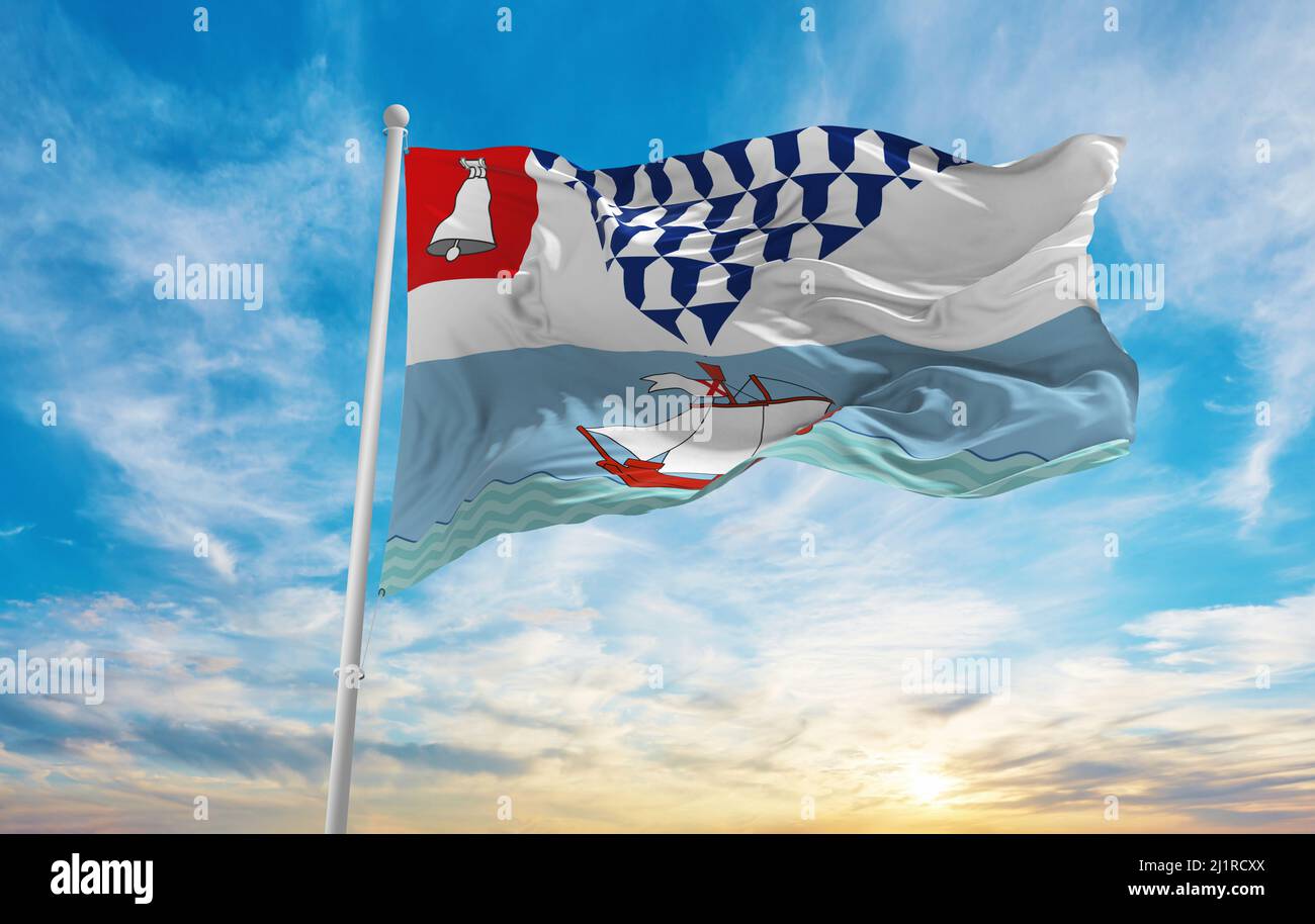 flag of Belfast , UK at cloudy sky background on sunset, panoramic view. County of united ...