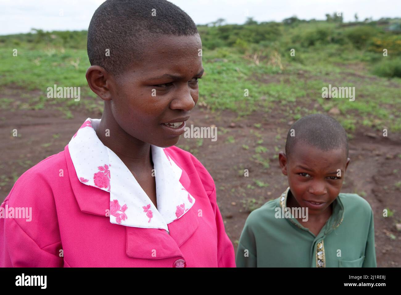 Poor girl feeds brother hi-res stock photography and images - Alamy