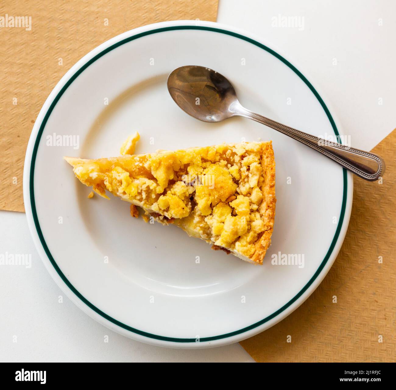 Traditional Dutch apple pie slice with streusel crumb topping on plate ...