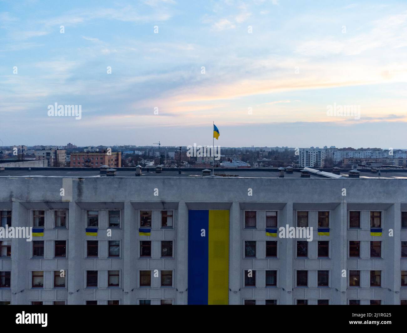 Aerial photo of Ukrainian flag on administration building in Poltava ...