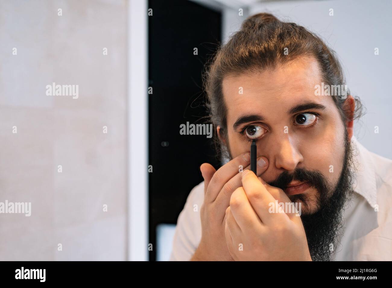 Man applying makeup transgender hi-res stock photography and images - Alamy