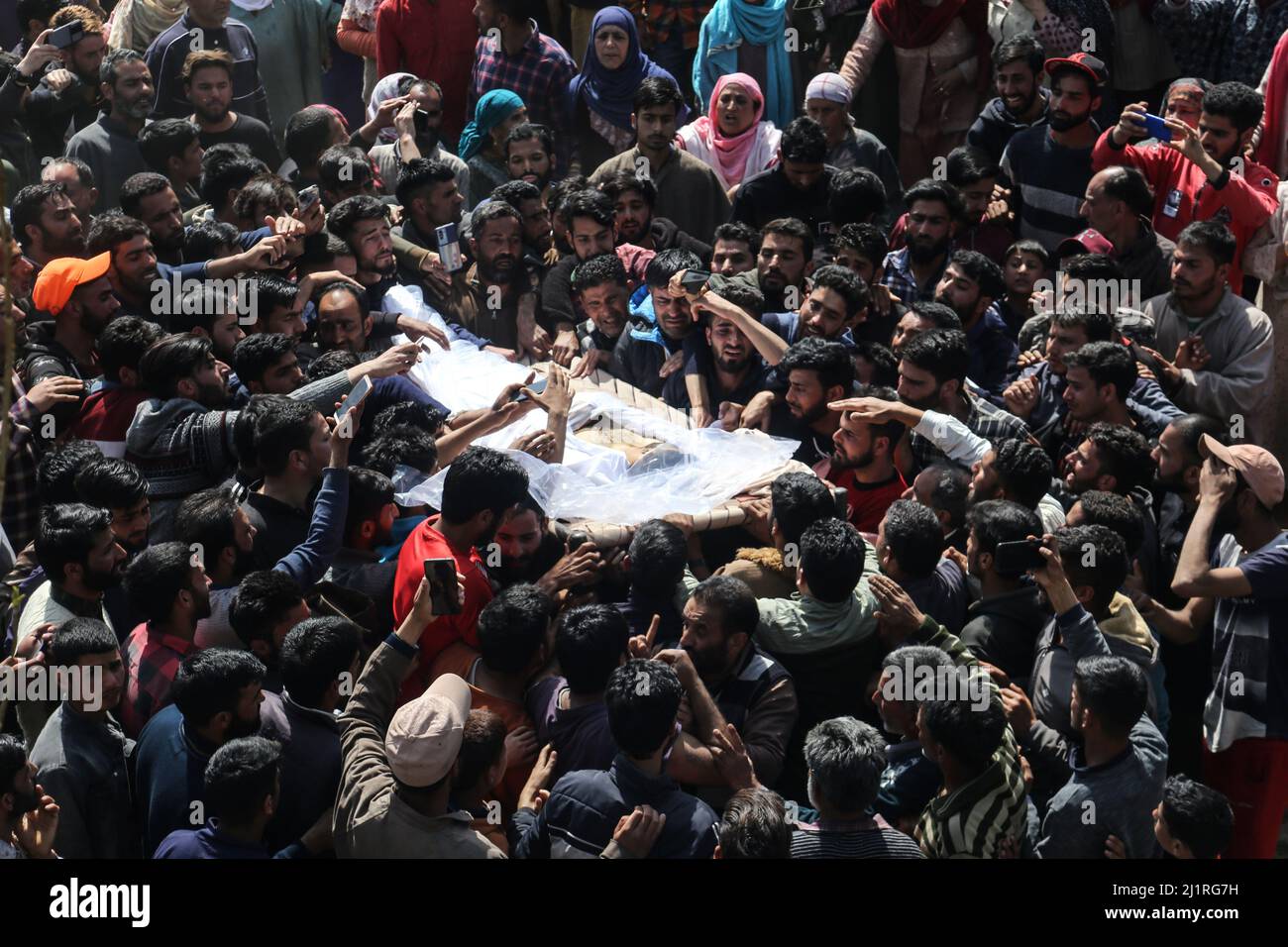Kashmiri villagers carry body of Umer Dar during the funeral procession ...