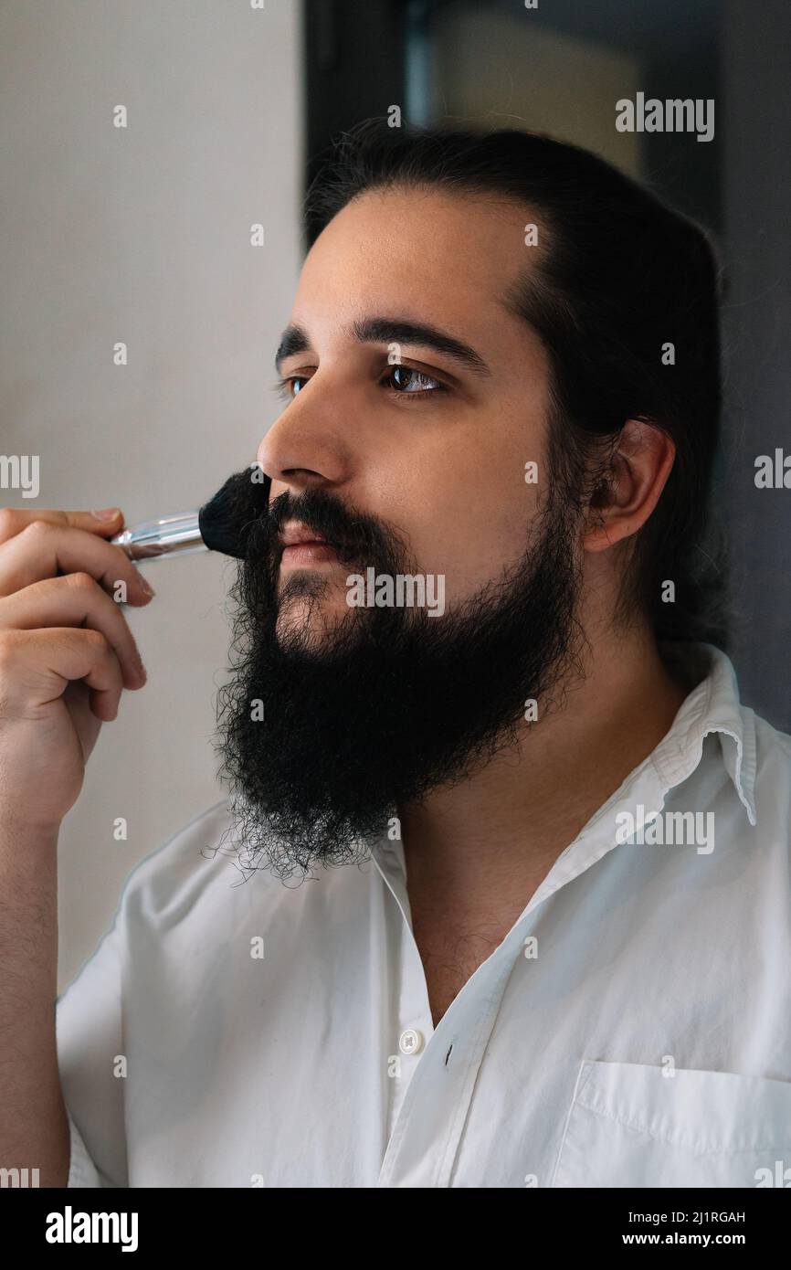 Man applying makeup transgender hi-res stock photography and images - Alamy