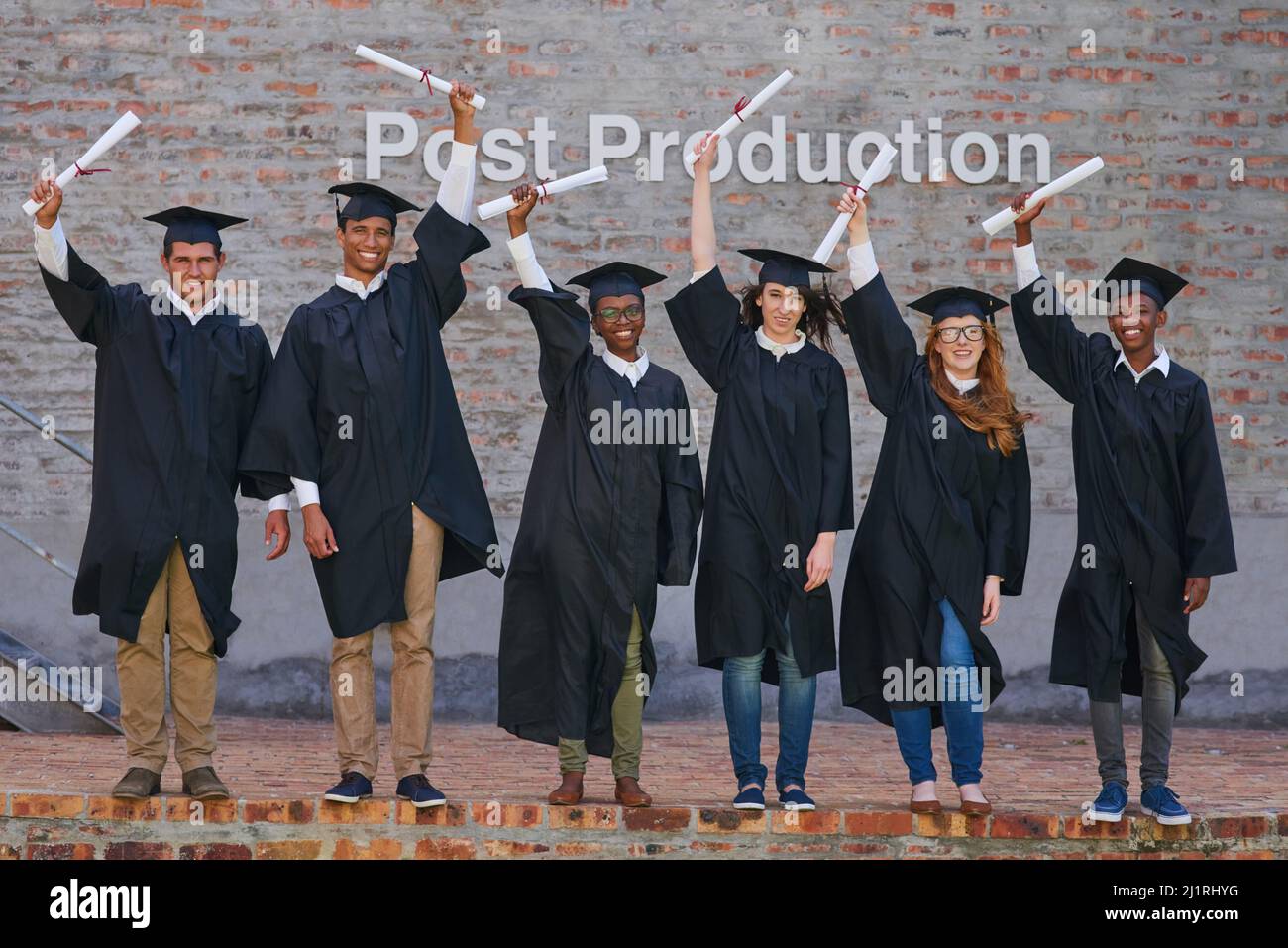 Graduation is just the beginning. Portrait of a happy group of students ...