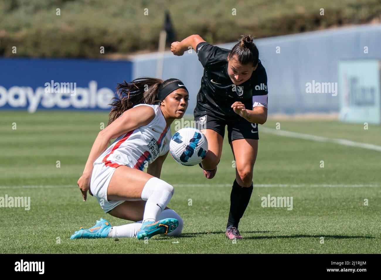 Angel City FC defender Ali Riley (5) gets past OL Reign forward Ally ...