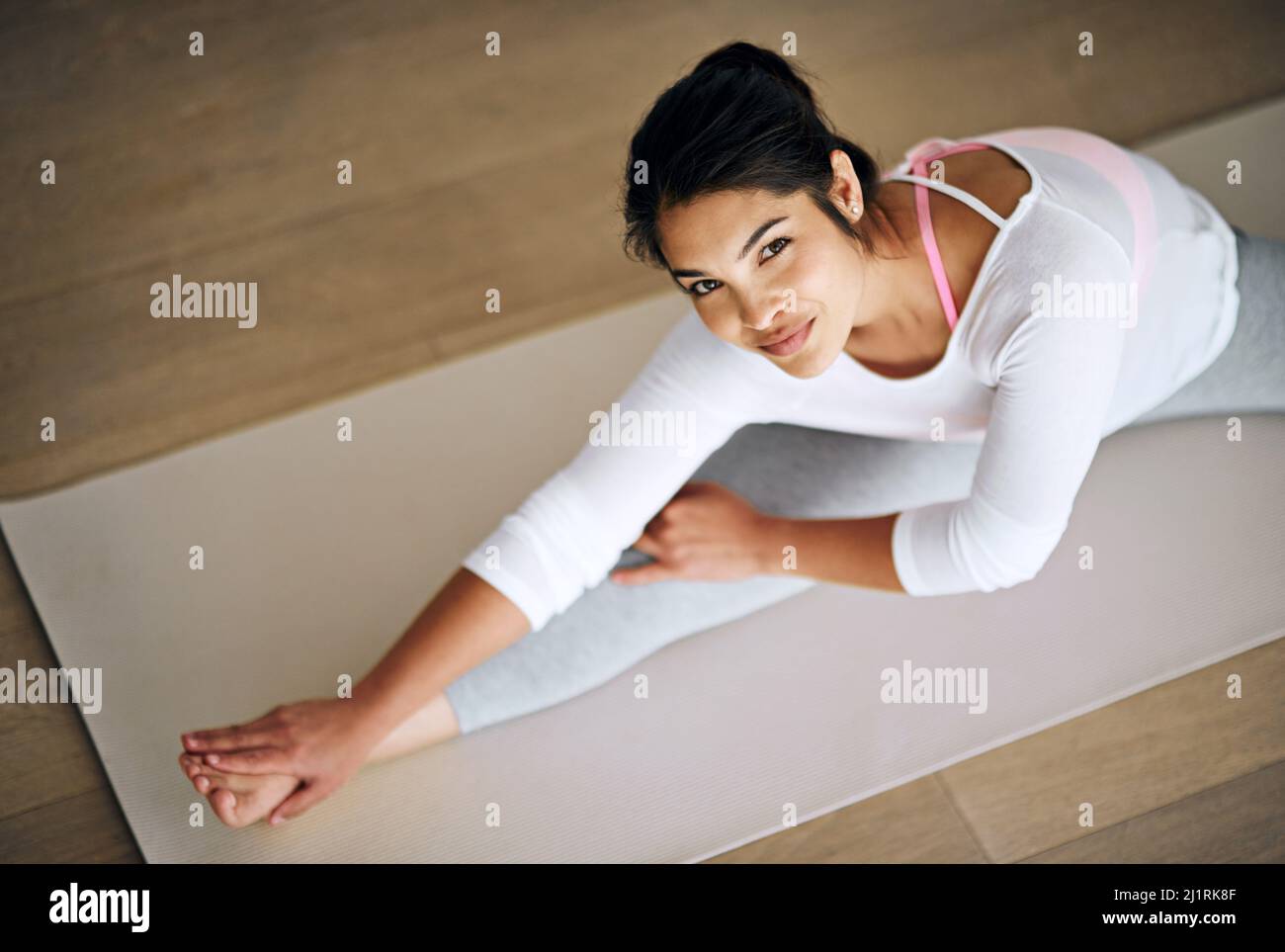 Doing yoga for the health of it. Portrait of an attractive young woman ...