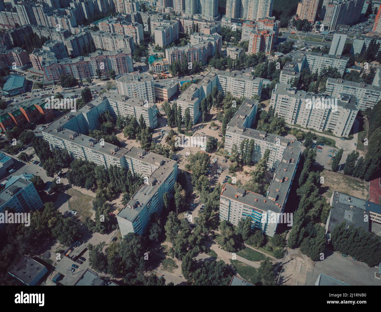 Drone view of new building complex in city center with houses Stock ...