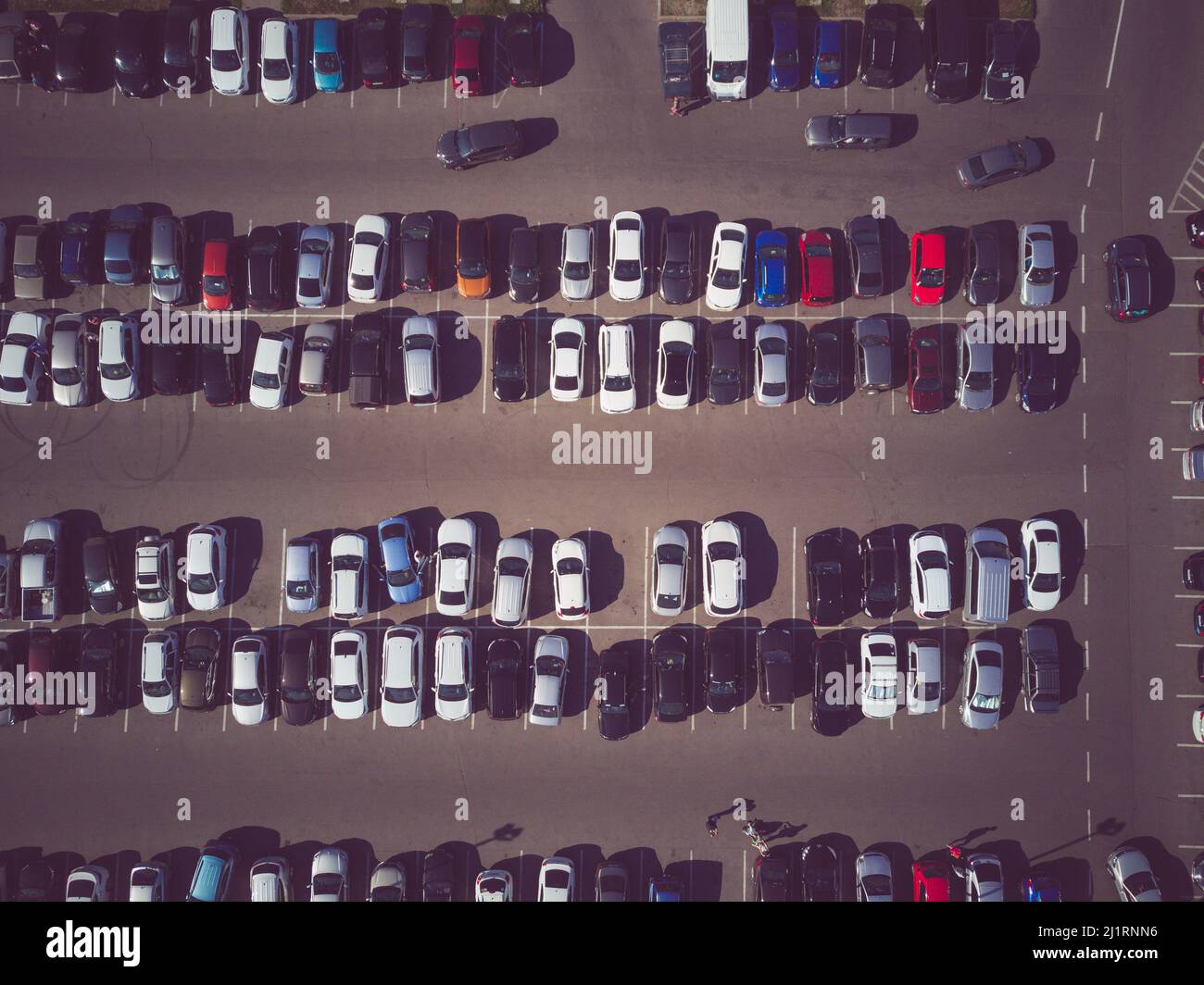 A view from above to the process of car parking. Heavy traffic in the ...