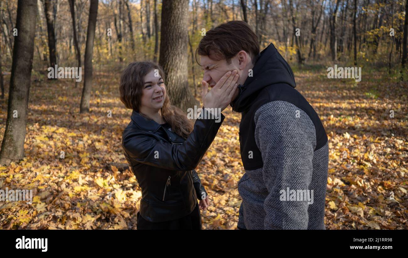 Unhappy scared man getting slapped standing into the park Stock Photo ...