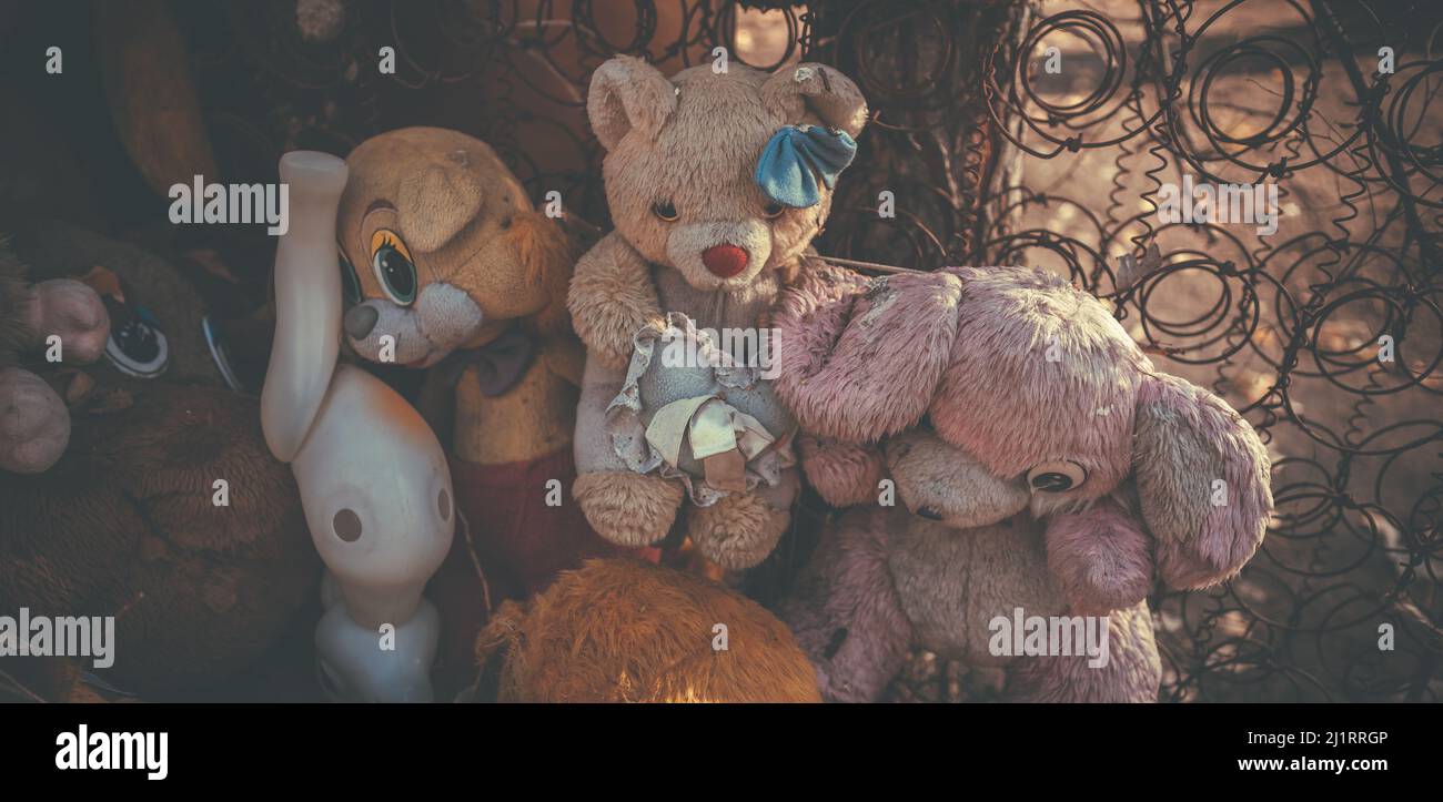 Old and battered soft toys lie on the street Stock Photo - Alamy