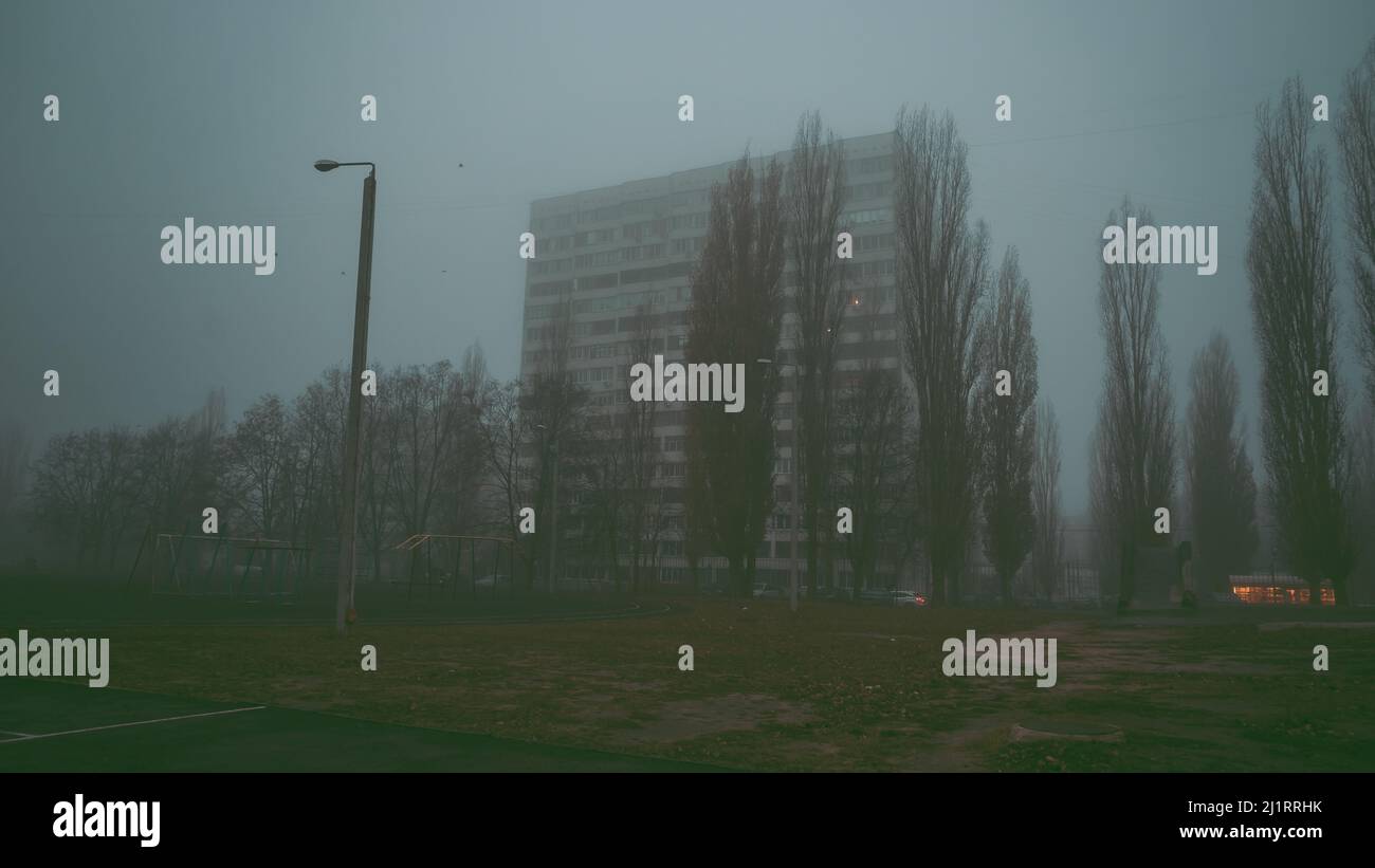 Modern apartment buildings in the morning on the background of fog ...