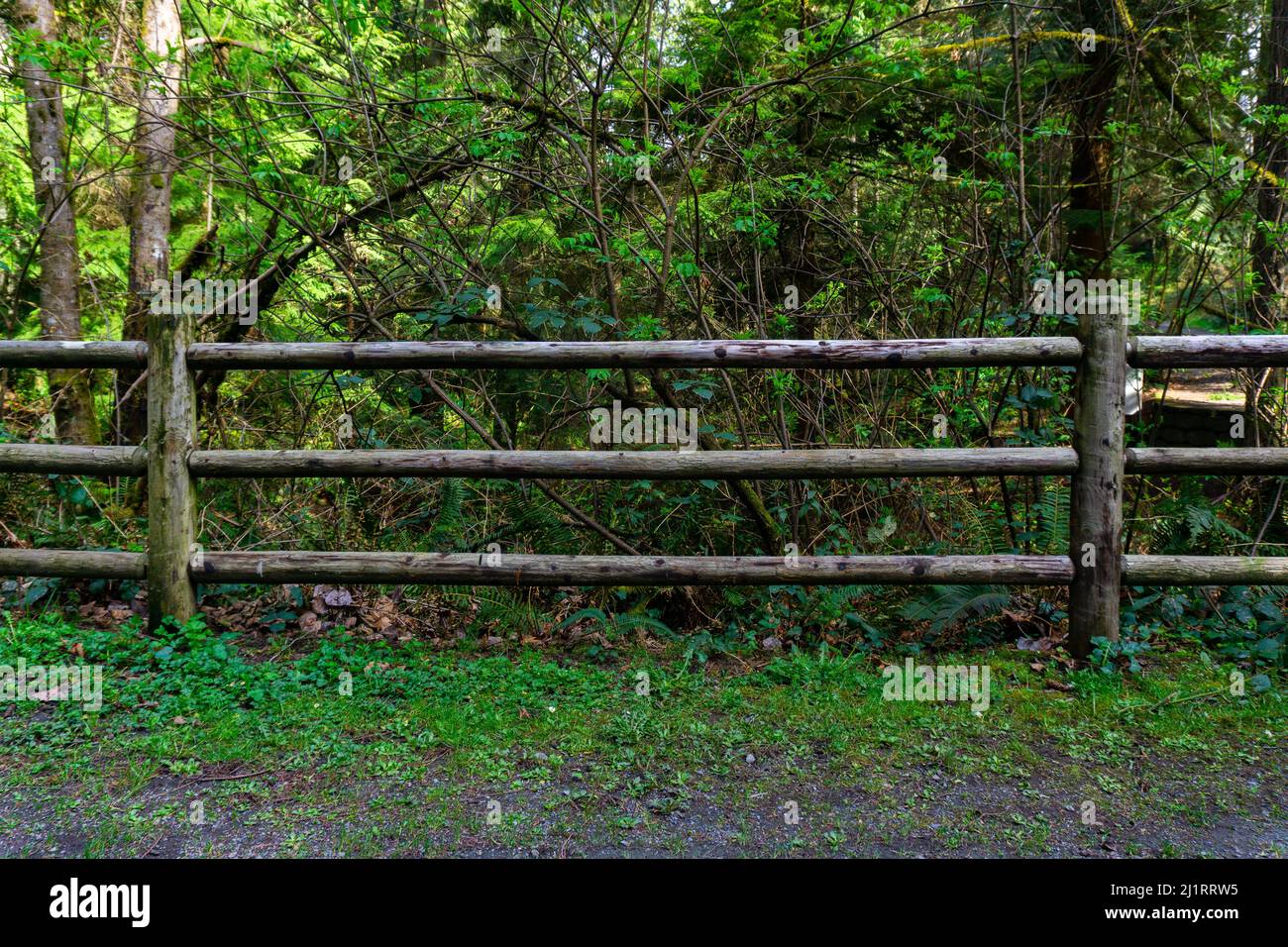 Three tier rail fence old in the middle of a park flat facing even ...