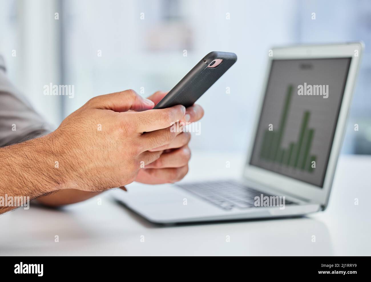 I hope she gets my text in time. Shot of a businessman using a ...