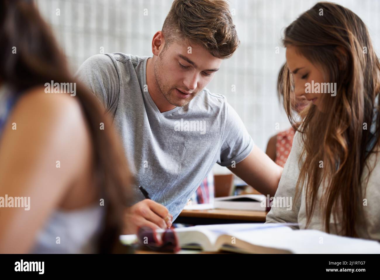 Working towards their future. students in a university classroom Stock ...