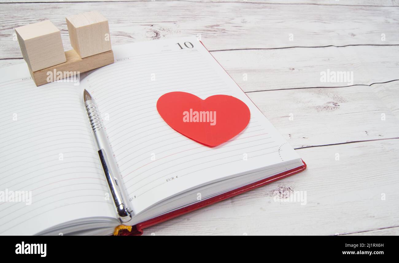 A close-up of an open diary for business reminders on Valentine's Day ...