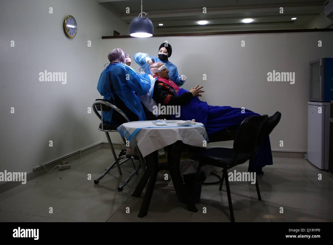 Gaza City. 19th Mar, 2022. A man receives a hair implant surgery at a ...