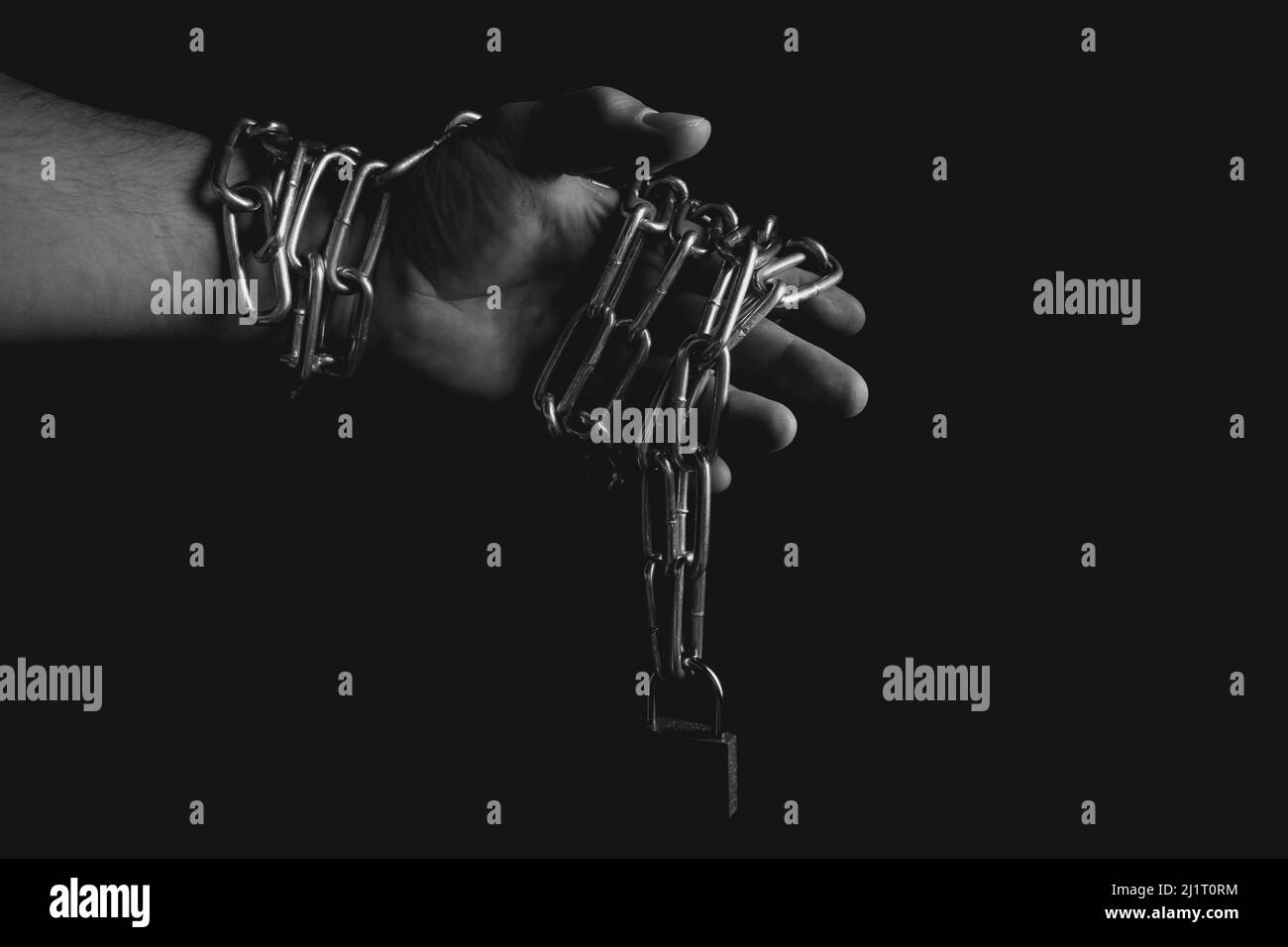 Chain and lock on hand. Arrest of a criminal. Handcuffs on the prisoner ...