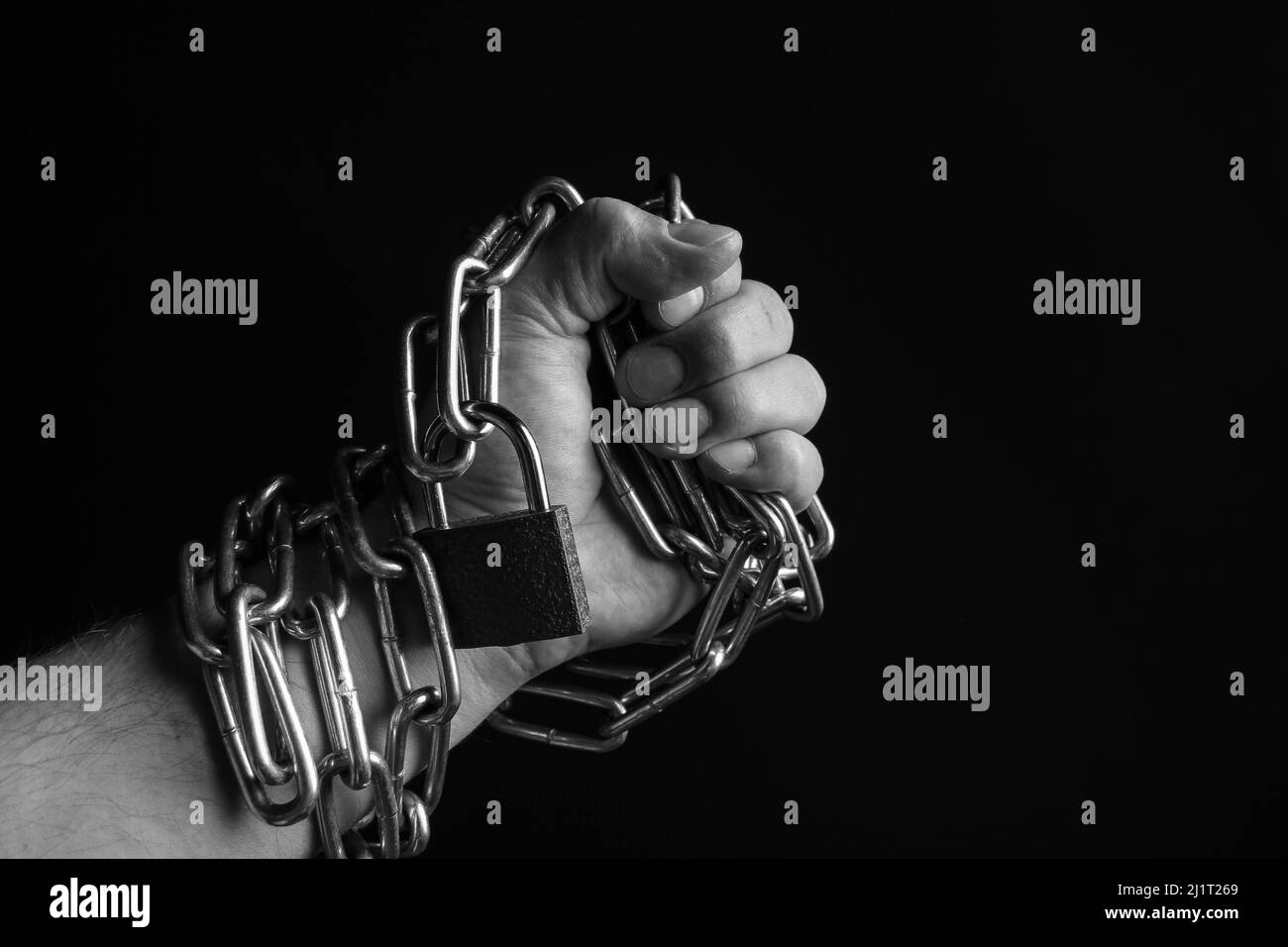 Chain and lock on hand. Arrest of a criminal. Handcuffs on the prisoner ...